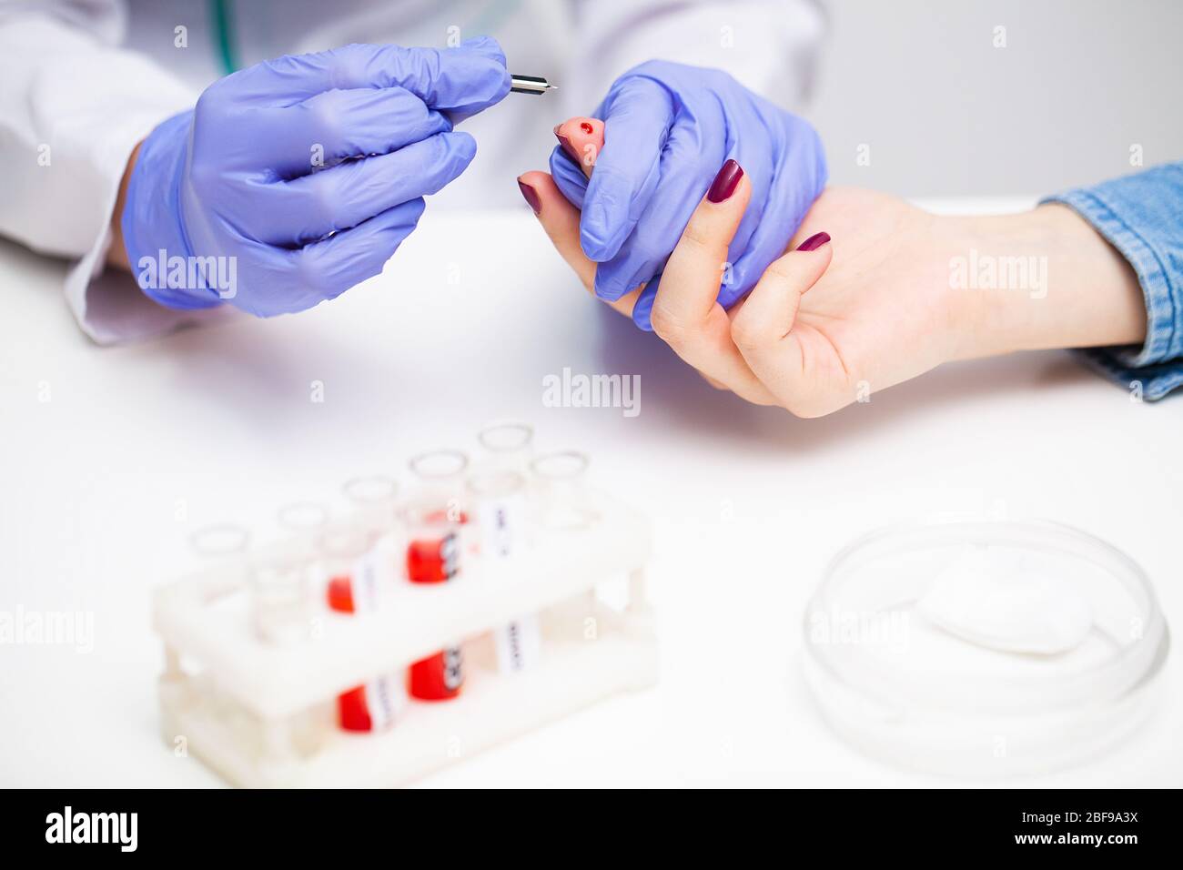 Woman at the hospital submits a blood test for a coronavirus Stock ...