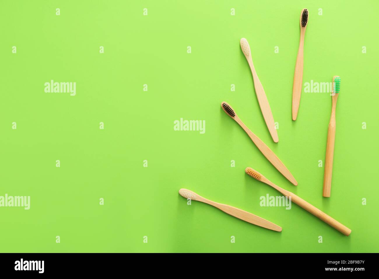 Tooth brushes on color background Stock Photo - Alamy