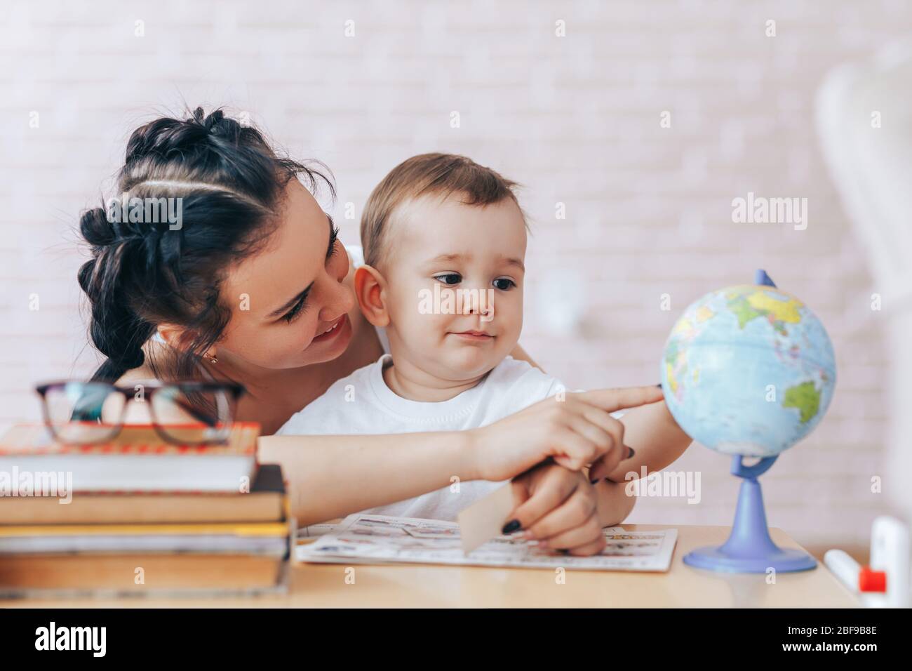 Teaching children with parents Stock Photo - Alamy