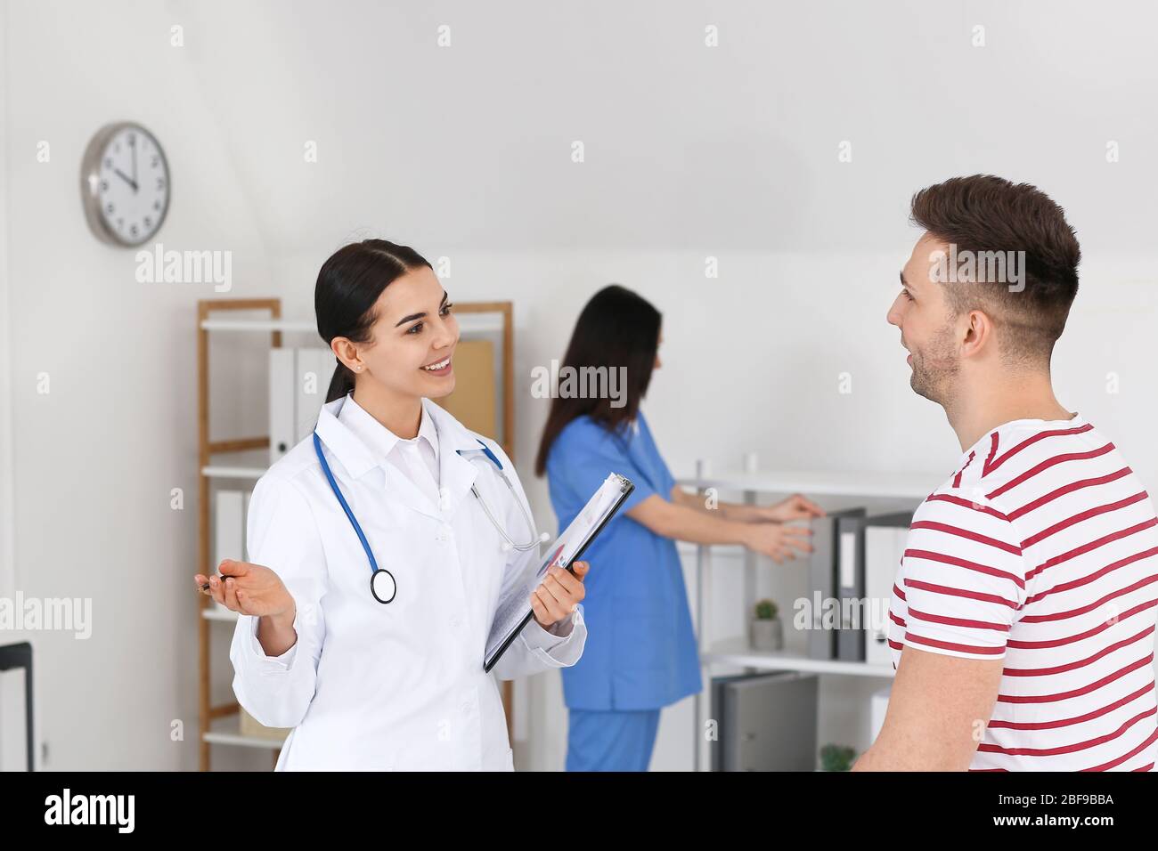 Male patient visiting doctor hi-res stock photography and images - Alamy