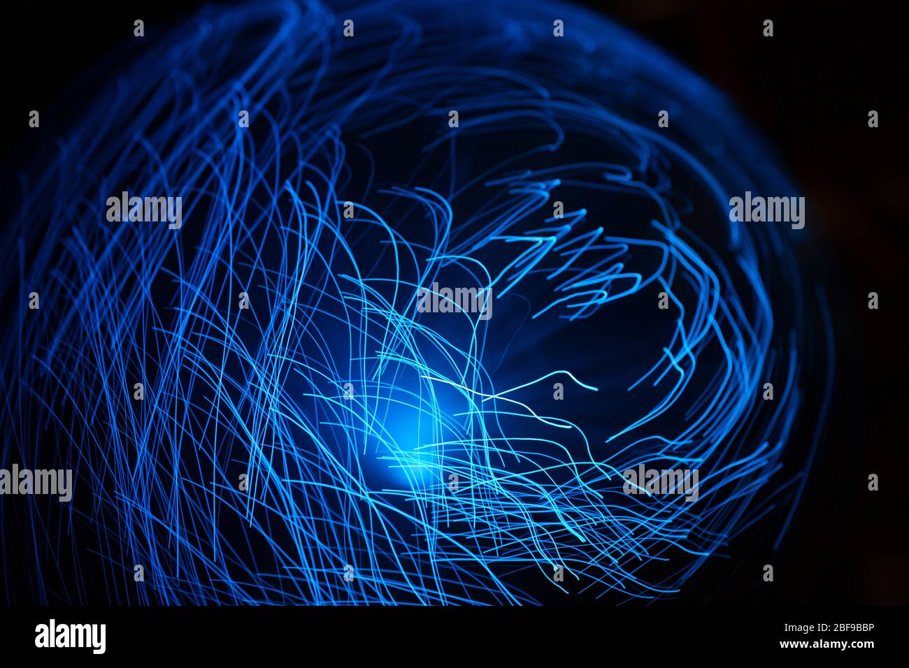 Blue abstract particles and lines with bokeh and blur in dark ...