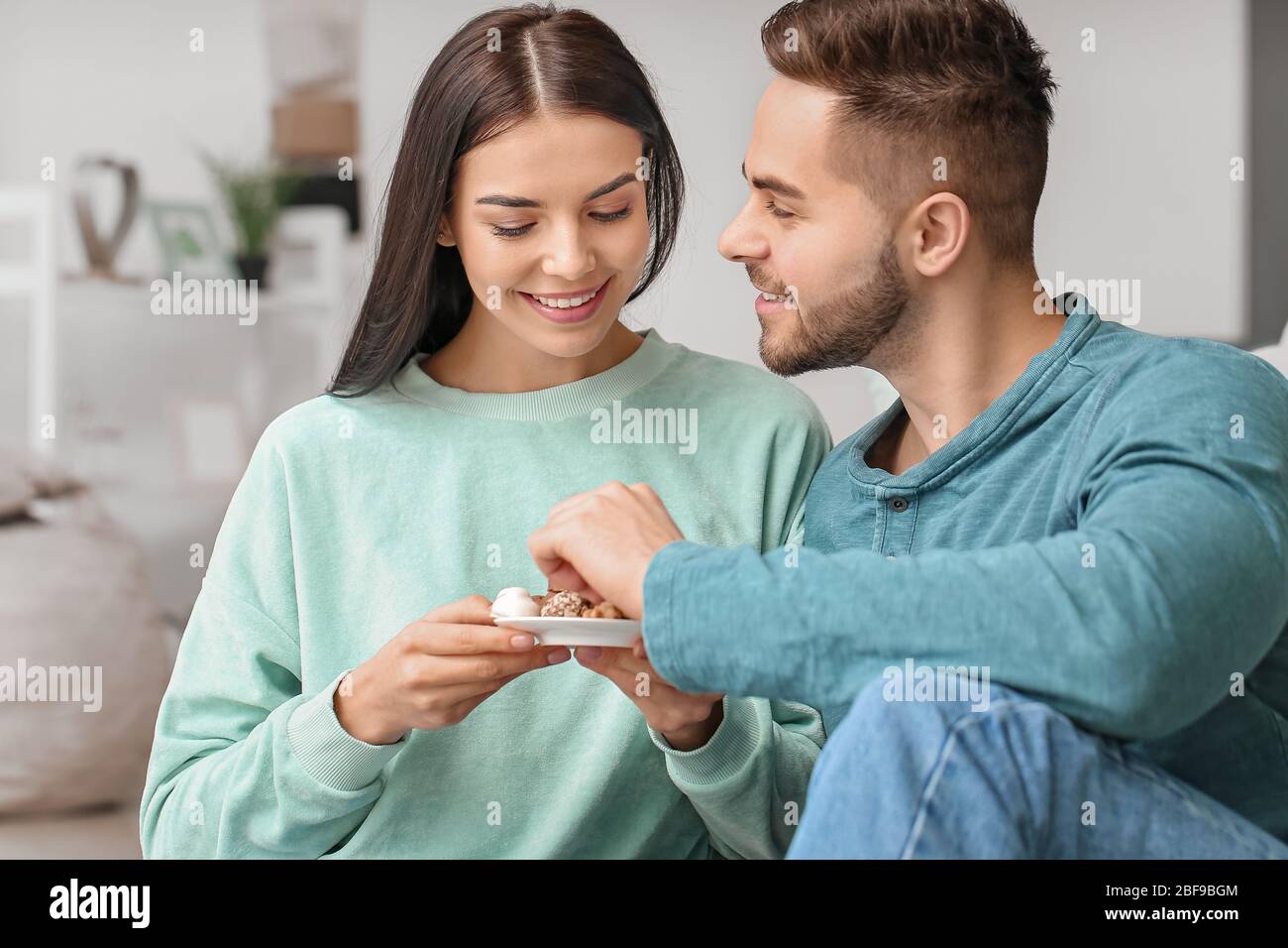 Guy eating chocolate bar and happy hi-res stock photography and images ...