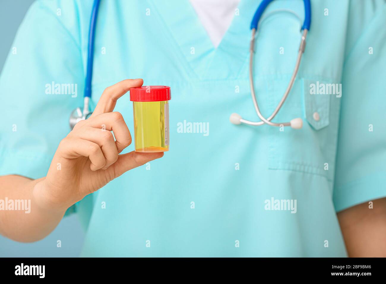 Doctor holding urine sample, closeup. Urology concept Stock Photo - Alamy