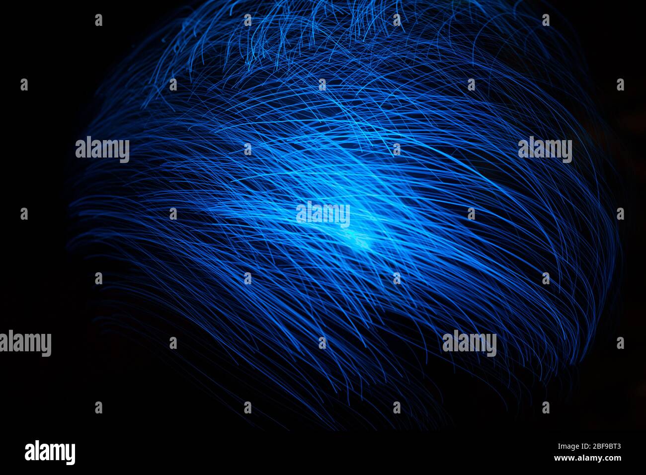 Blue abstract particles and lines with bokeh and blur in dark ...