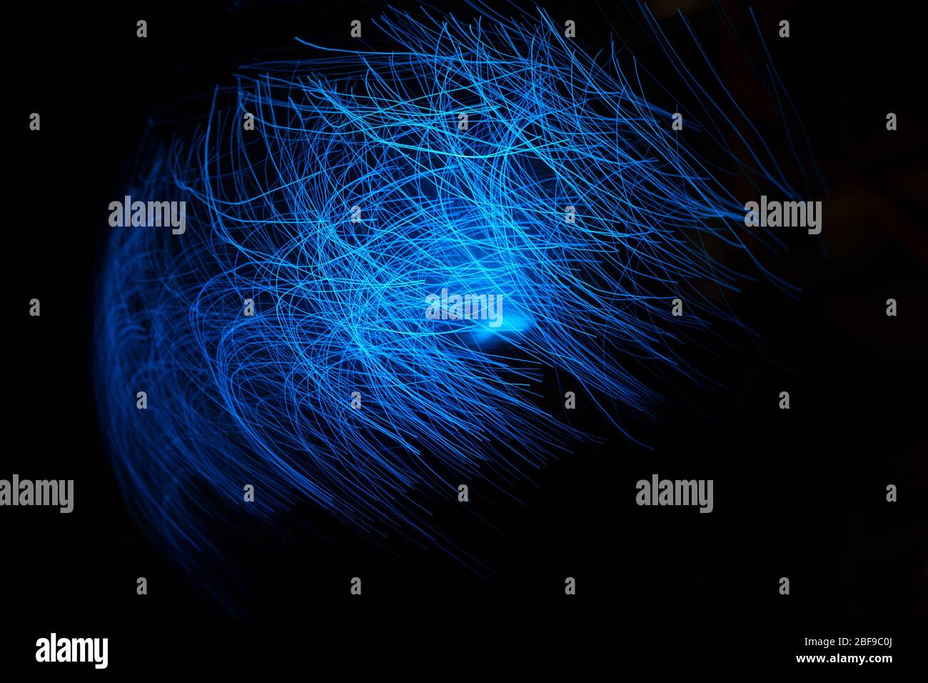 Blue abstract particles and lines with bokeh and blur in dark ...