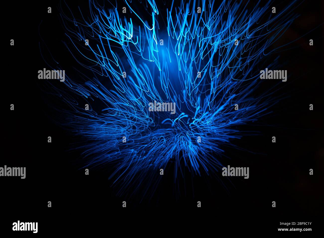 Blue abstract particles and lines with bokeh and blur in dark ...