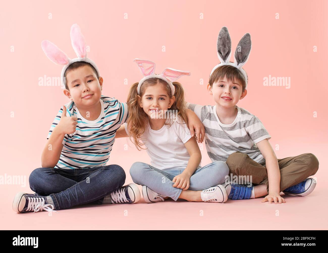 Children with bunny ears hi-res stock photography and images - Alamy
