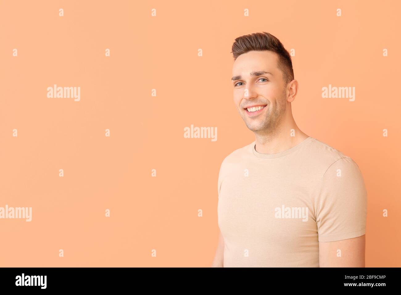 Portrait of handsome man on color background Stock Photo - Alamy