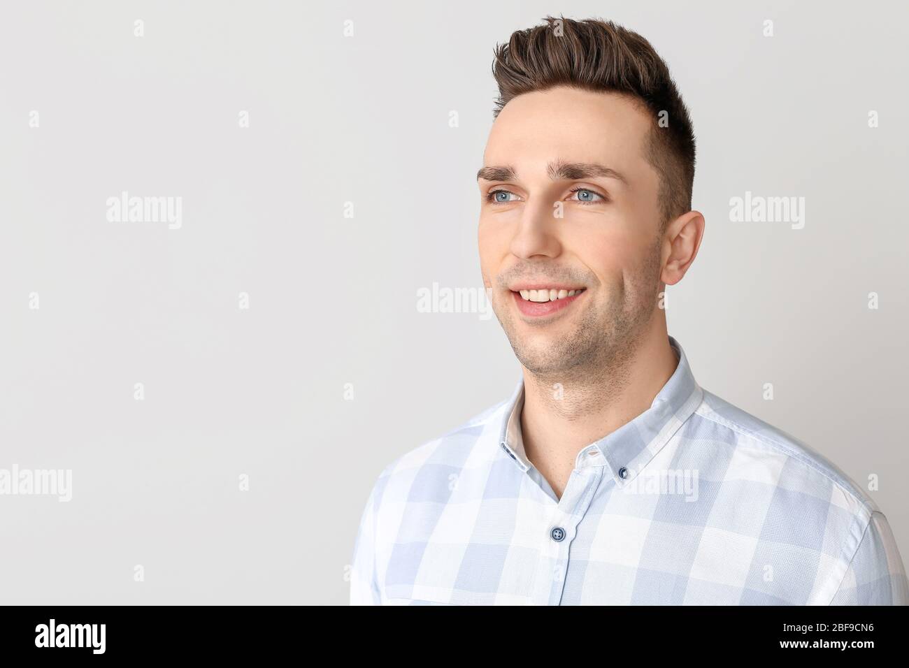 Portrait of handsome man on light background Stock Photo - Alamy