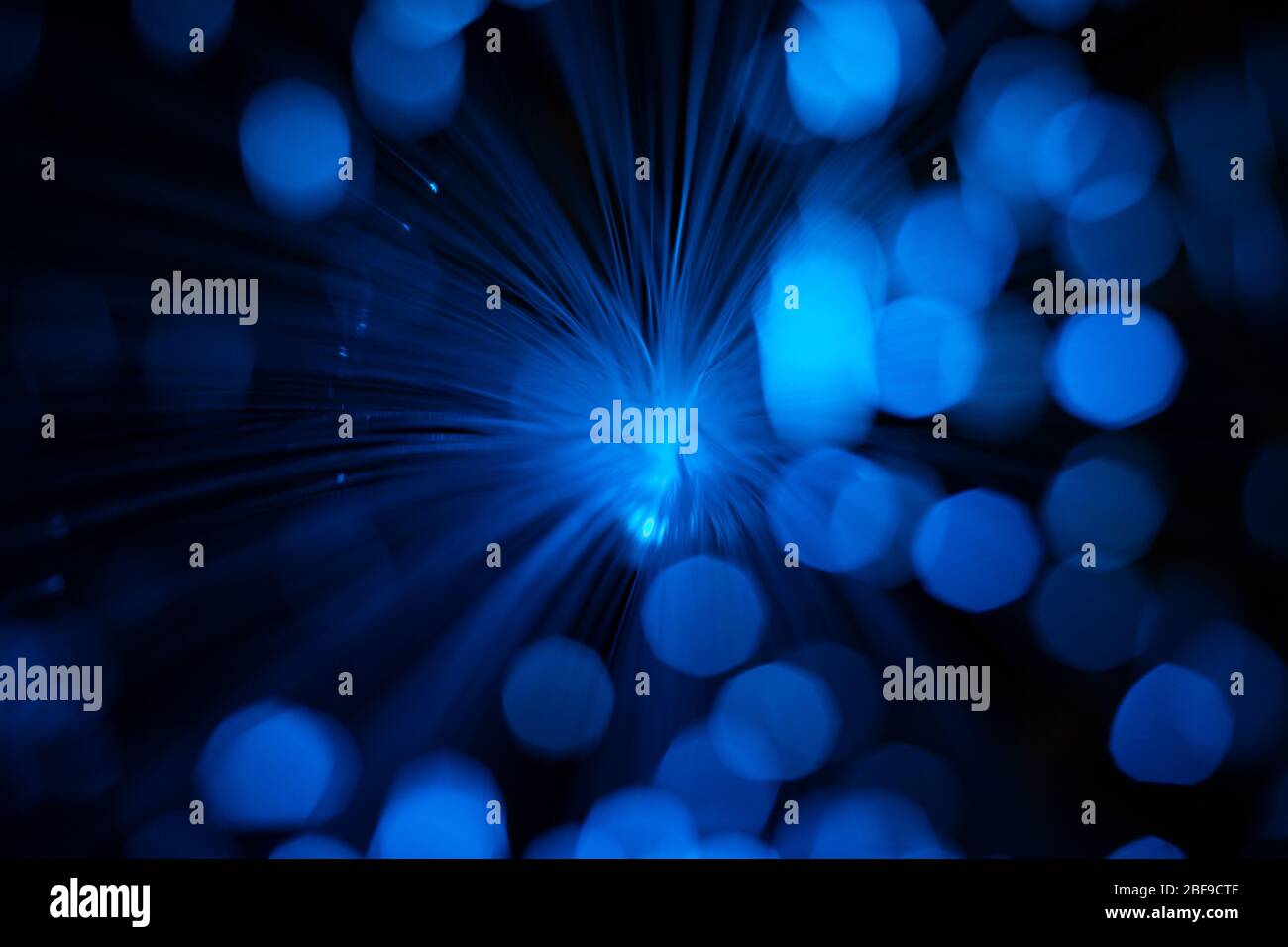 Blue abstract particles and lines with bokeh and blur in dark ...