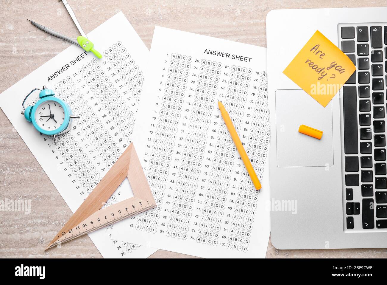 Answer sheet forms with laptop and stationery on table. Concept of ...