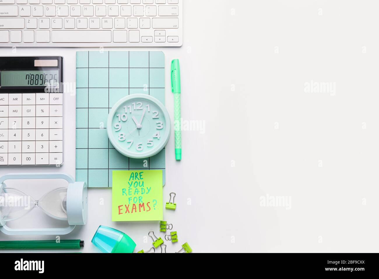 Stationery, computer keyboard and paper sheet with text ARE YOU READY ...