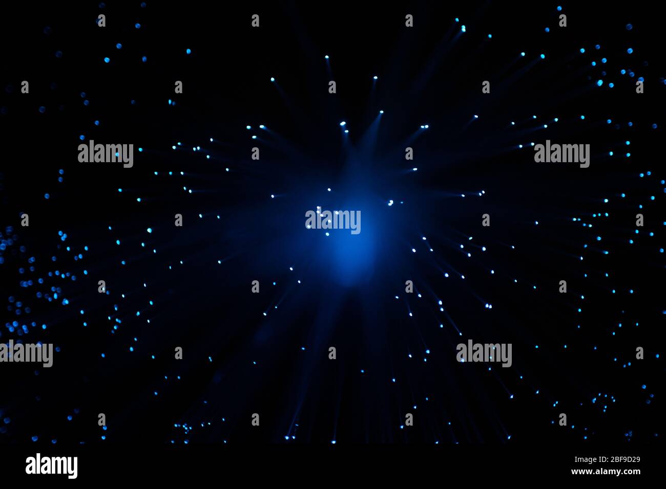 Blue abstract particles and lines with bokeh and blur in dark ...