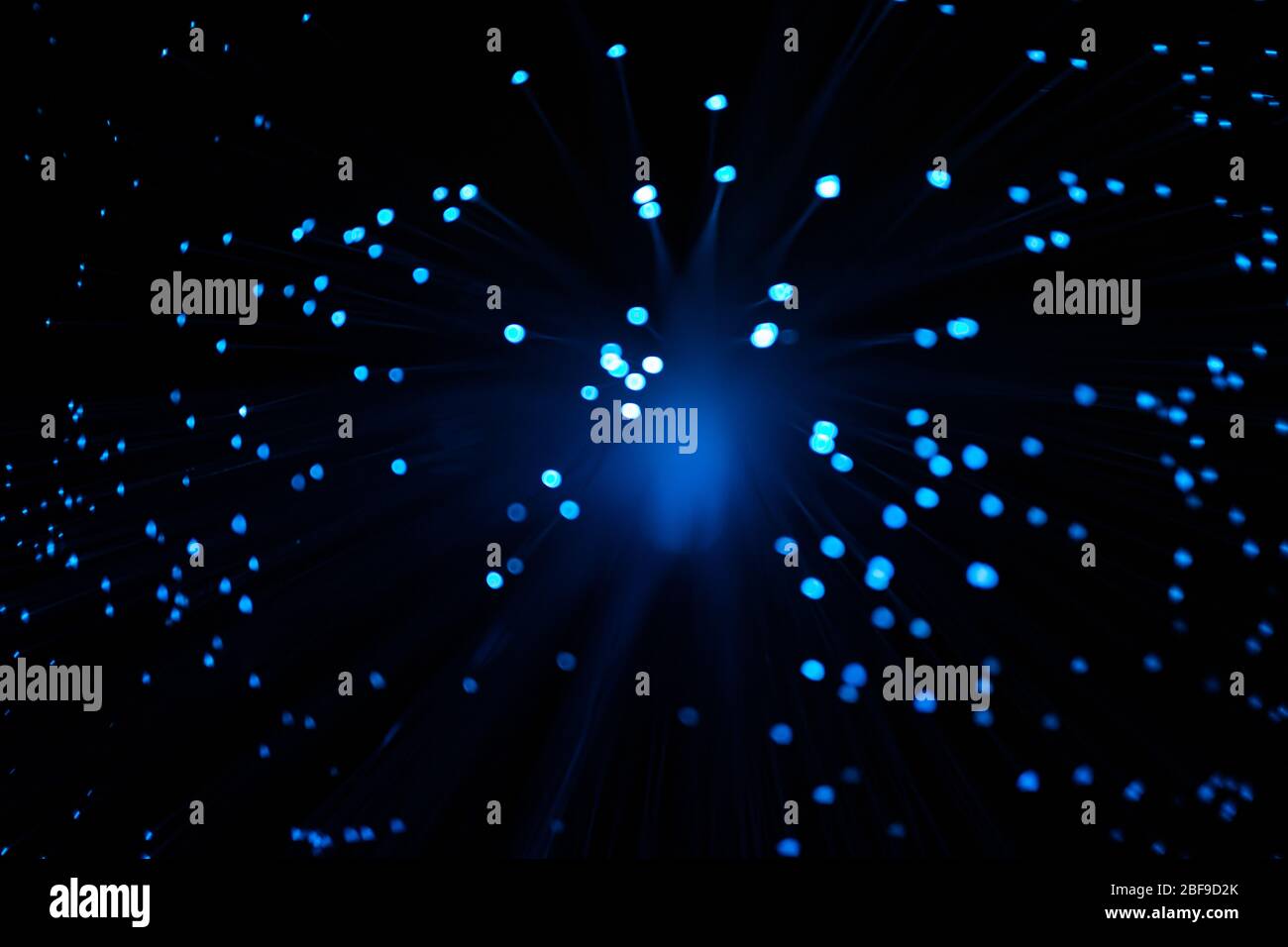 Blue abstract particles and lines with bokeh and blur in dark ...