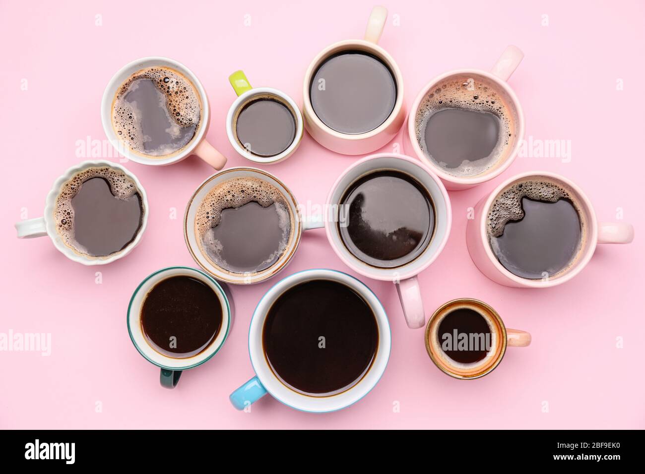 Cups of coffee on color background Stock Photo - Alamy