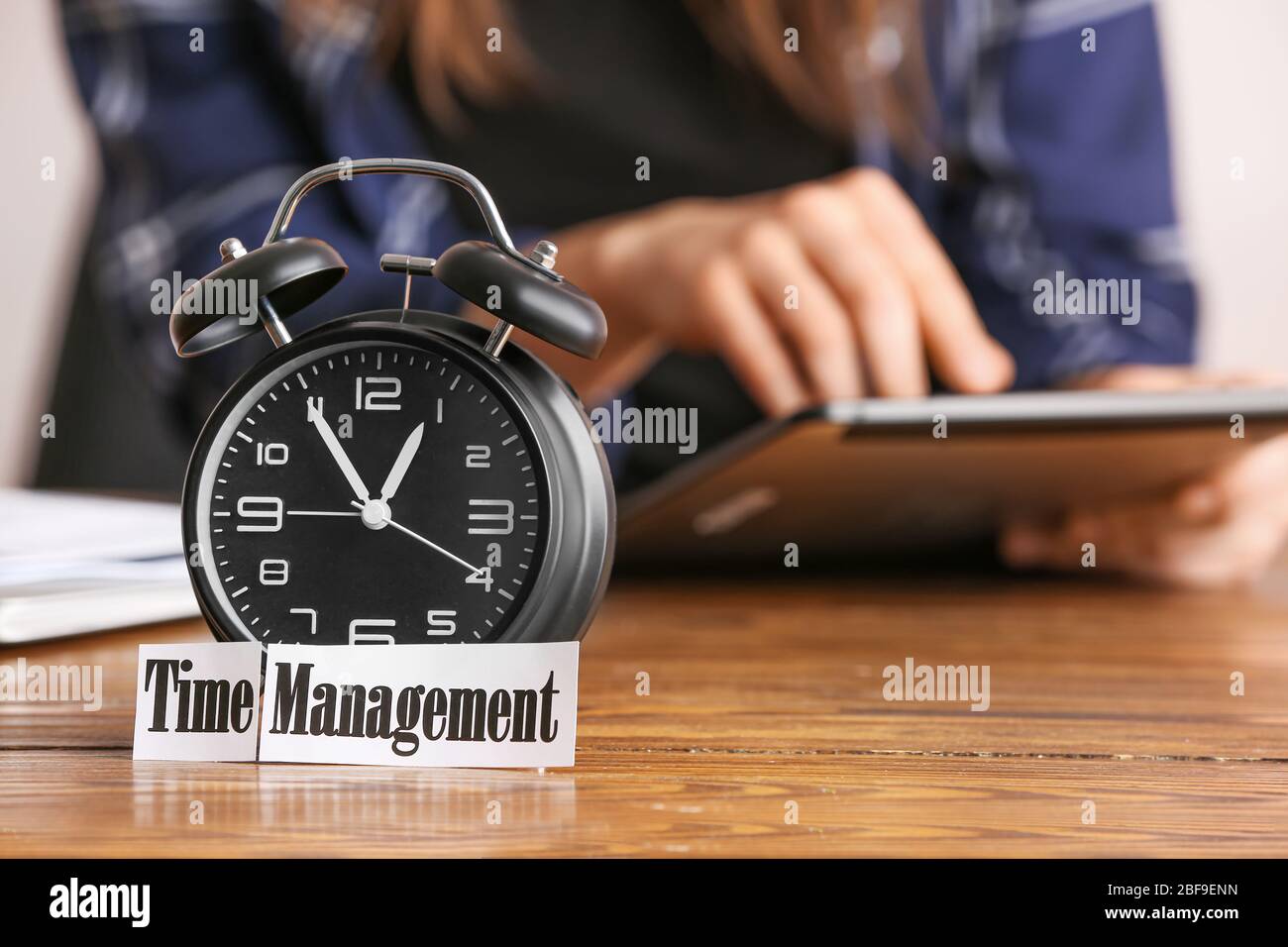 Alarm clock on office table. Time management concept Stock Photo - Alamy