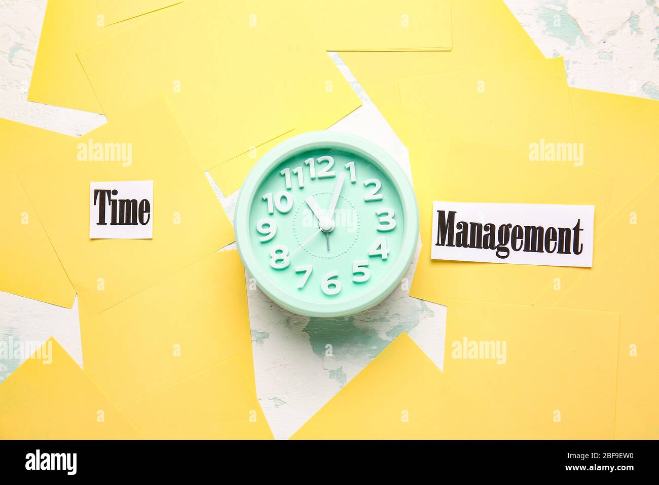 Alarm clock and text TIME MANAGEMENT on table Stock Photo - Alamy