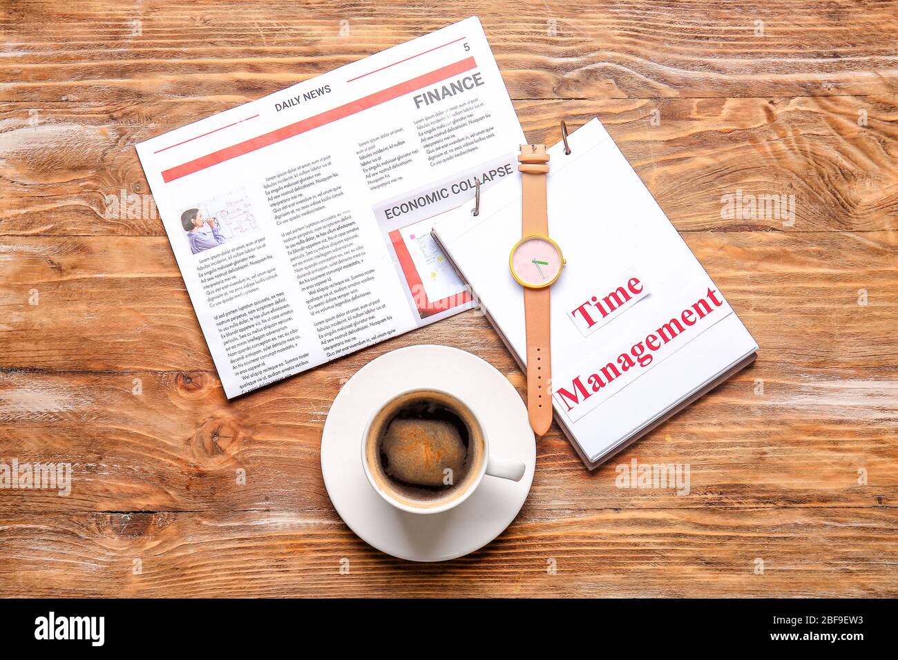 Watch, newspaper, notebook and coffee on wooden background. Time ...