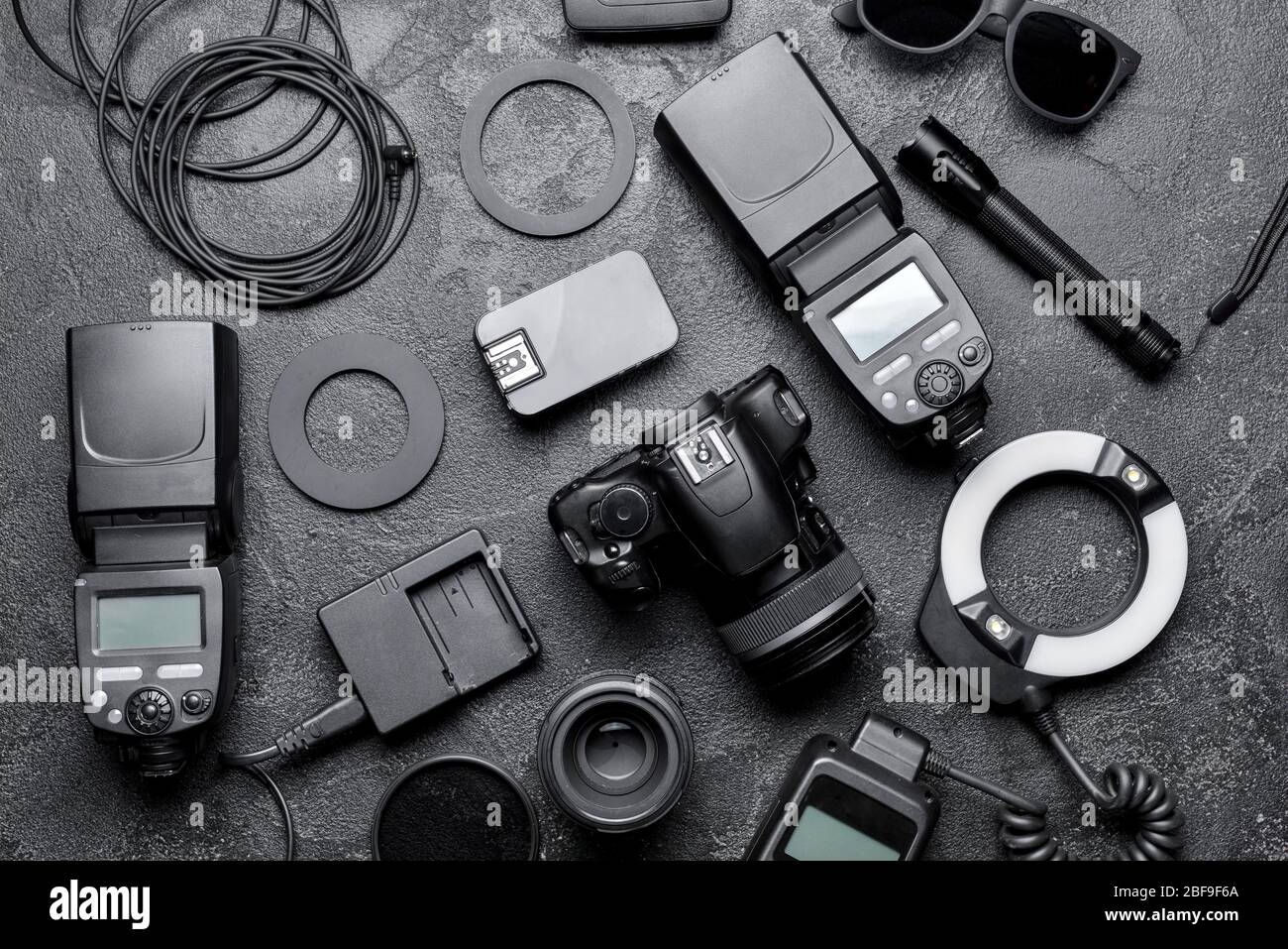 Modern photographer's equipment on dark background Stock Photo - Alamy
