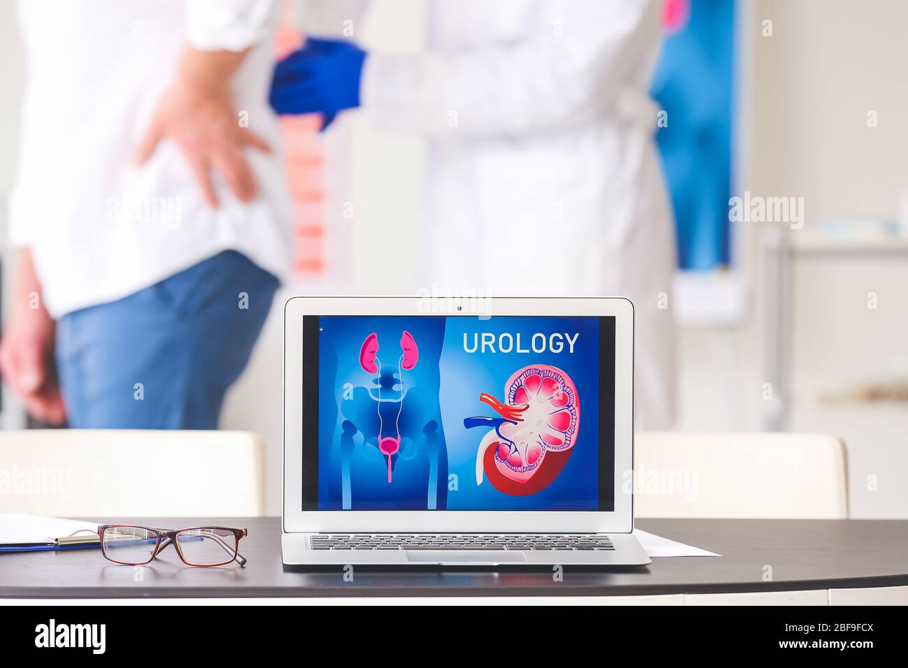 Modern laptop on table in urologist's office Stock Photo - Alamy