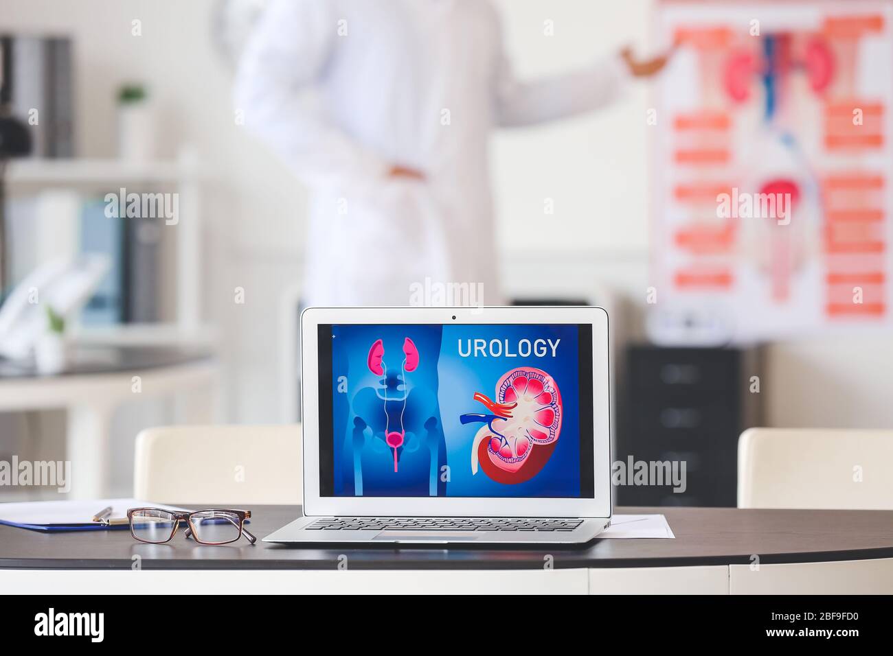 Modern laptop on table in urologist's office Stock Photo - Alamy