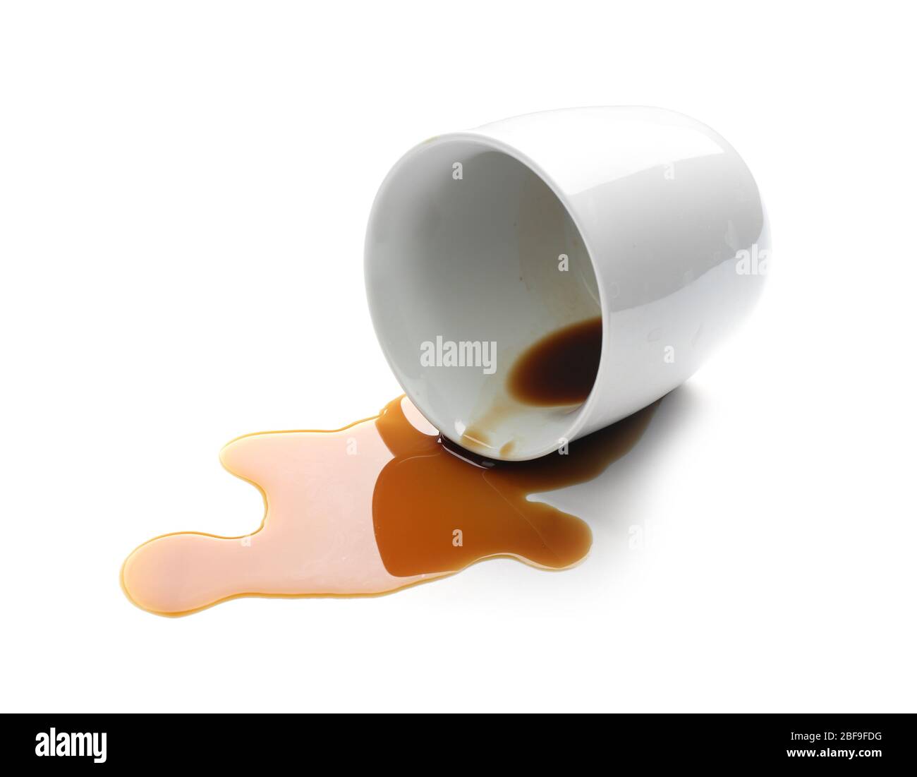 Overturned cup and spilled coffee on white background Stock Photo - Alamy