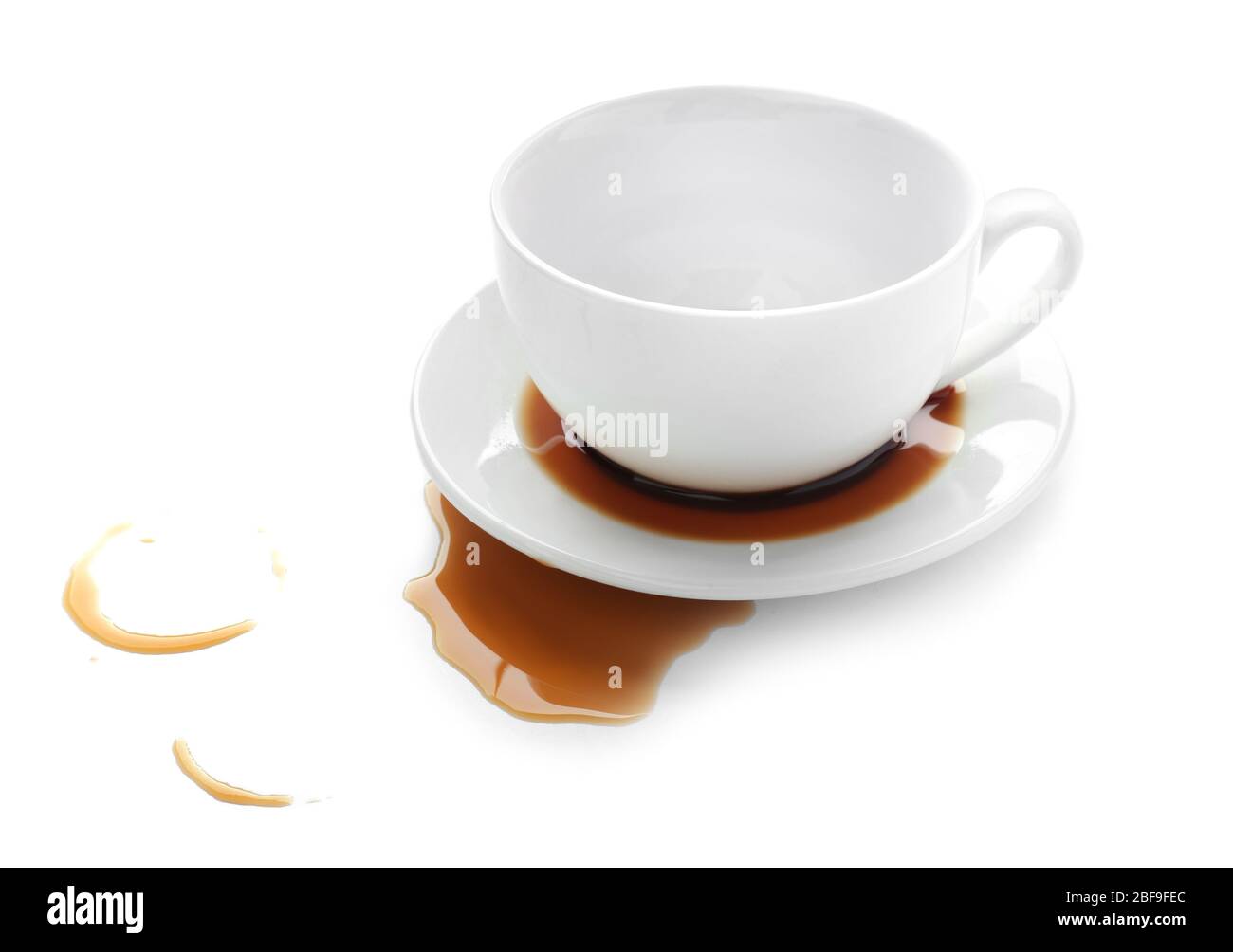 Cup and spilled coffee on white background Stock Photo - Alamy