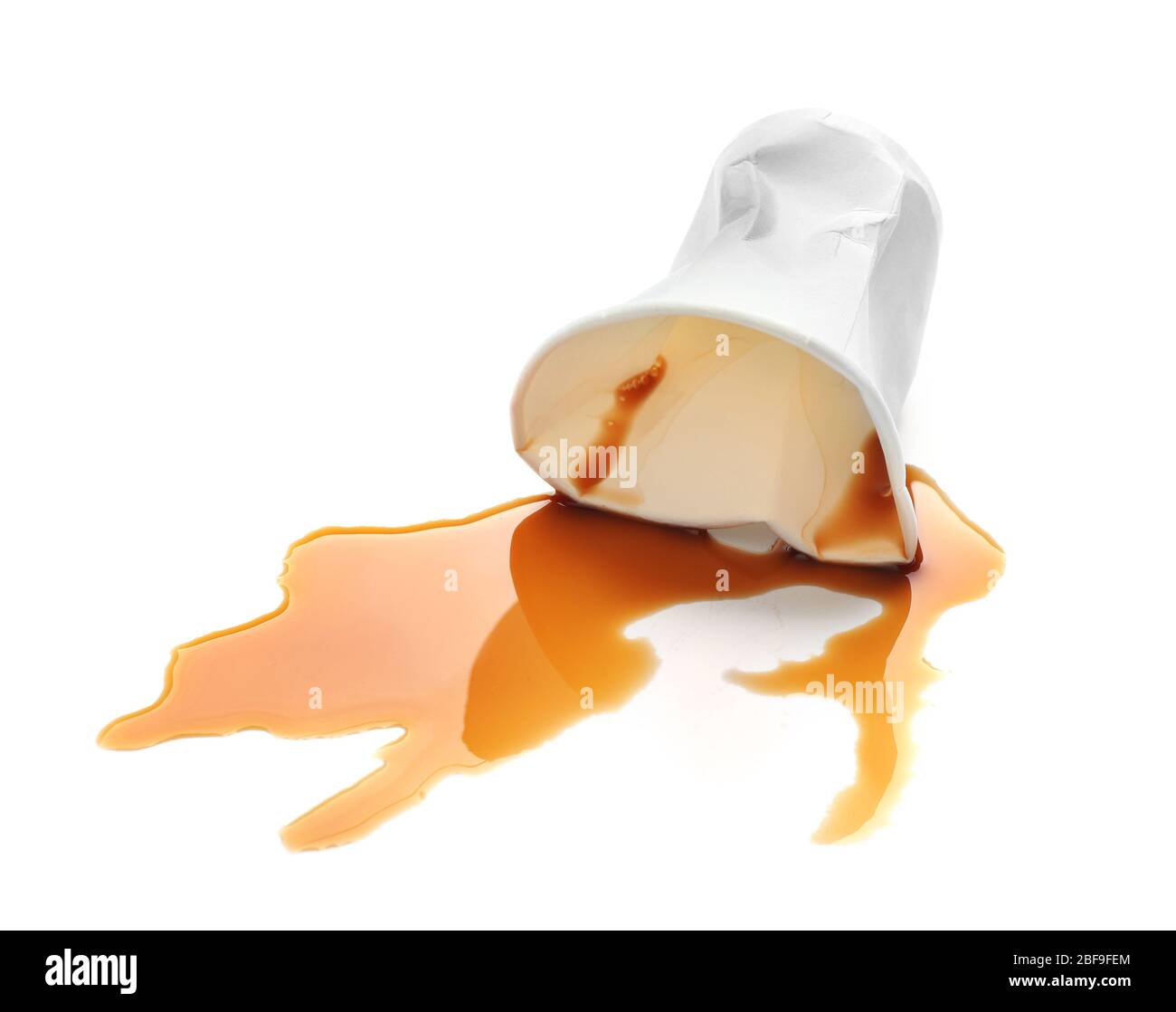 Overturned paper cup and spilled coffee on white background Stock Photo ...