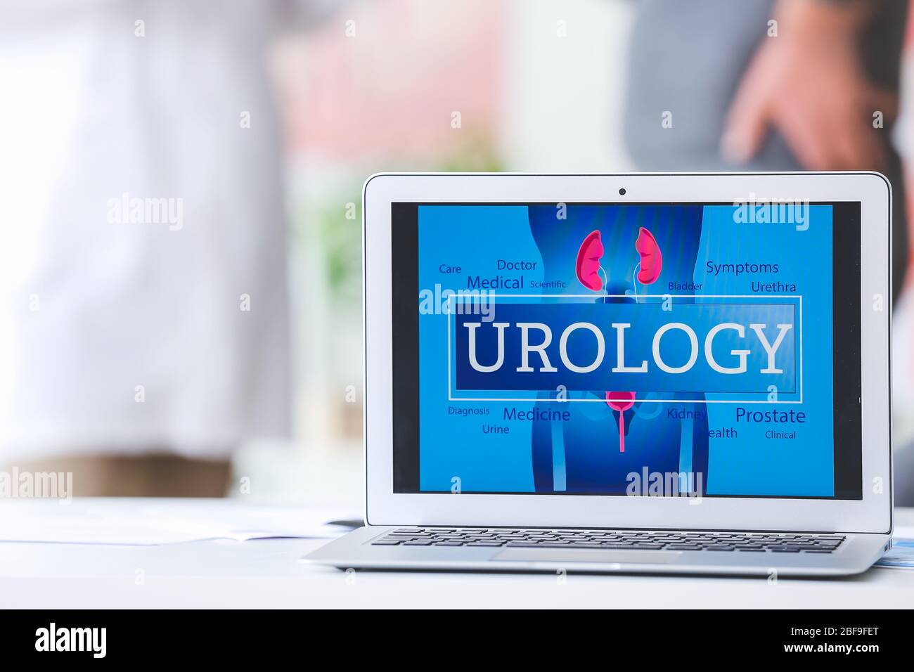 Modern laptop on table in urologist's office Stock Photo - Alamy