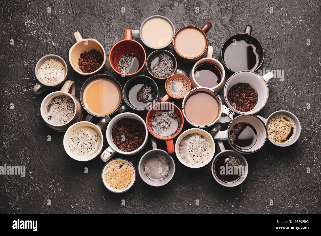 Many cups of different coffee on dark background Stock Photo - Alamy