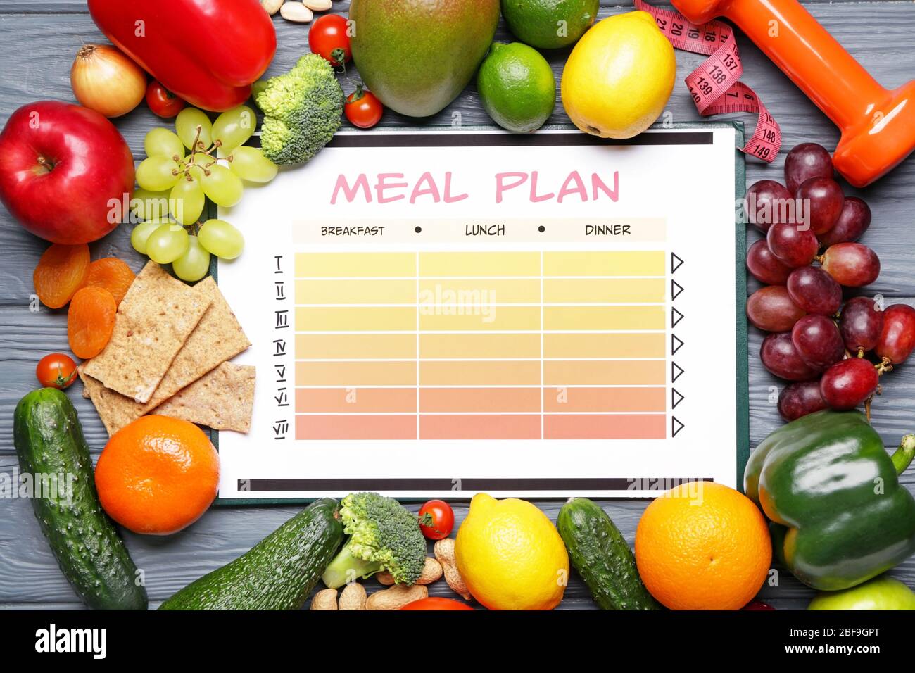 Healthy products and meal plan on wooden background Stock Photo - Alamy