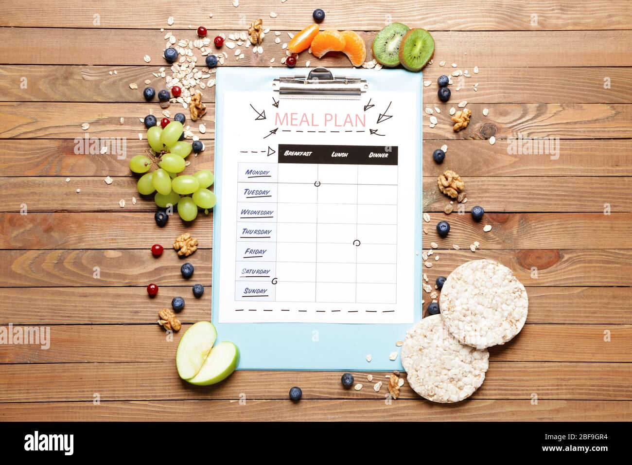 Healthy products and meal plan on wooden background Stock Photo - Alamy