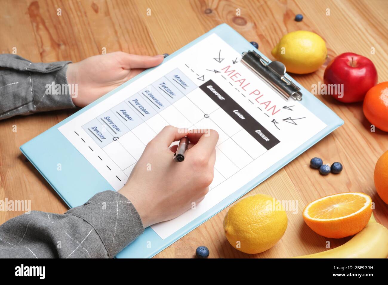 Woman making meal plan hi-res stock photography and images - Alamy