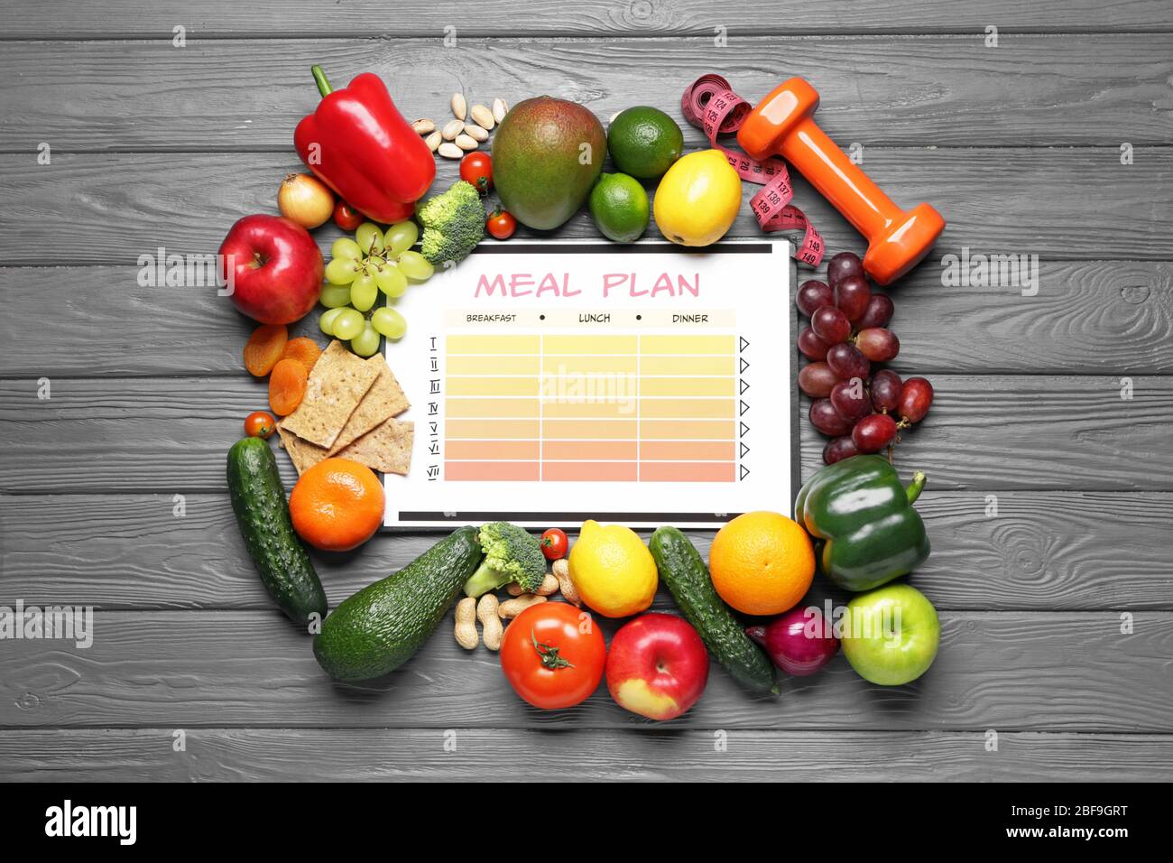 Healthy products and meal plan on wooden background Stock Photo - Alamy