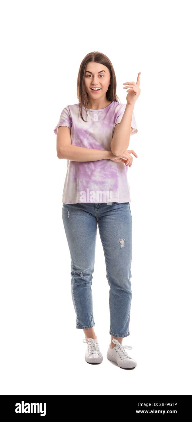 Beautiful young woman with raised index finger on white background ...