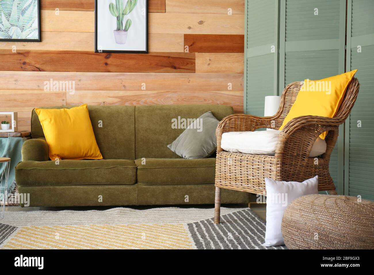 Interior of modern room with comfortable armchair and sofa in room ...
