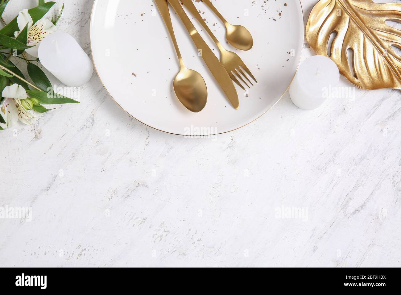 Table setting on white background Stock Photo - Alamy