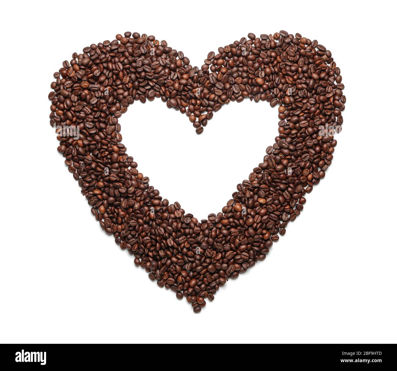 Heart made of coffee beans on white background Stock Photo - Alamy