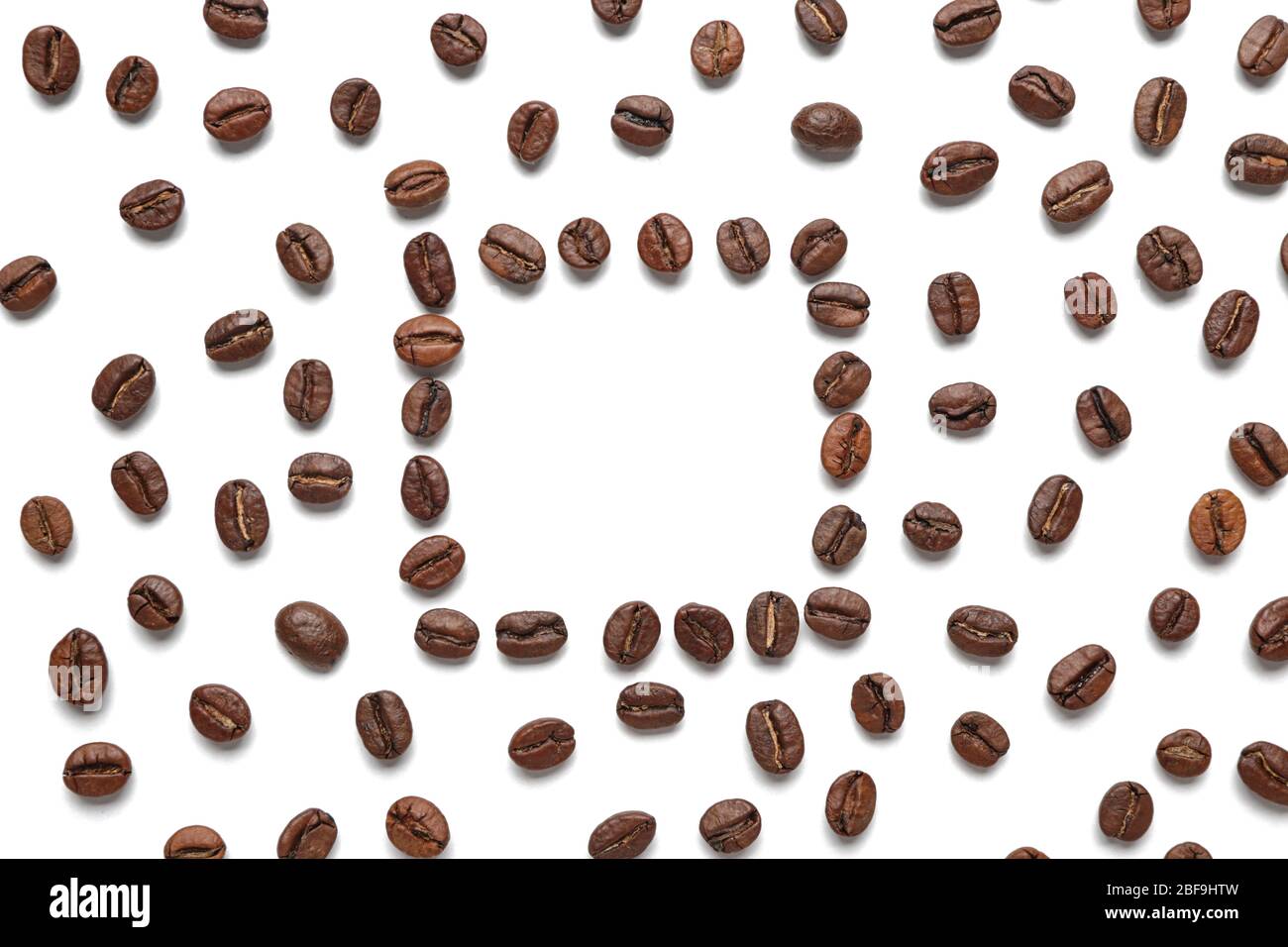 Frame made of coffee beans on white background Stock Photo - Alamy