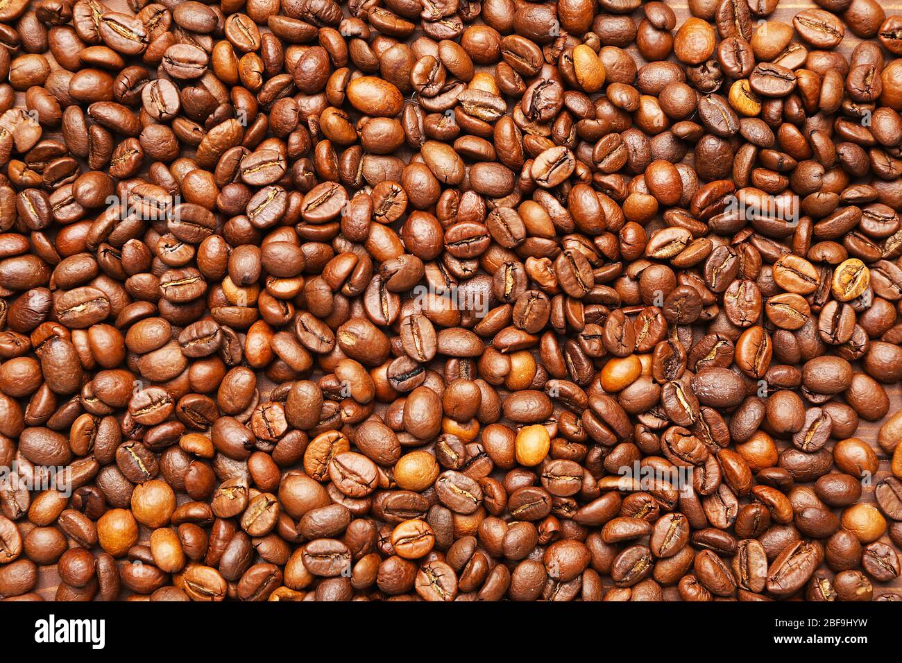 Many coffee beans as background Stock Photo - Alamy
