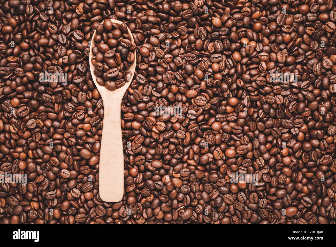 Spoon on roasted coffee beans Stock Photo - Alamy