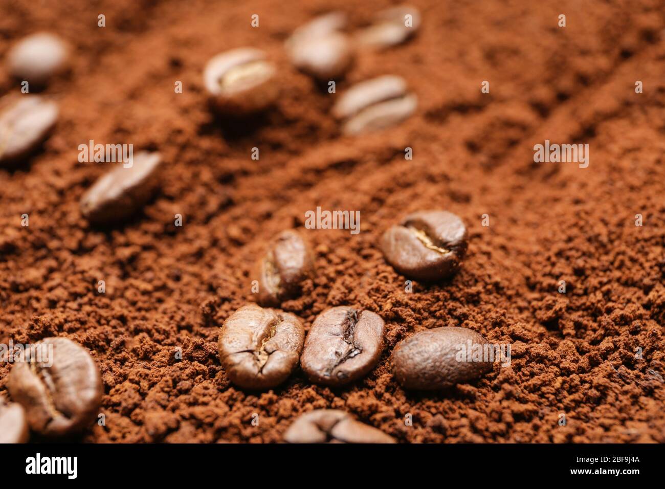 Milled coffee and beans, closeup Stock Photo - Alamy