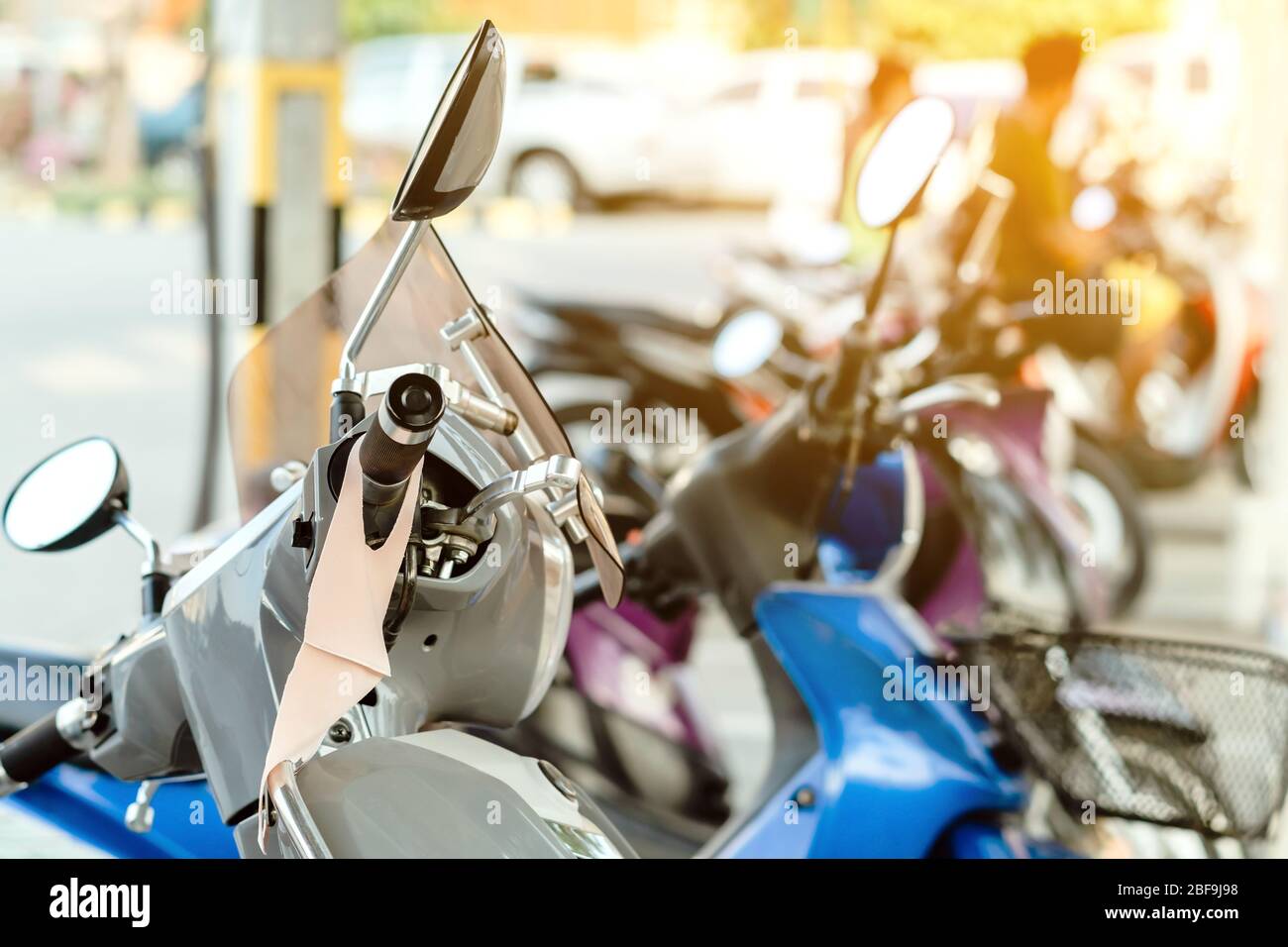 A mask hanging on a motorcycle handle to prevent germs (Covid-19) on ...