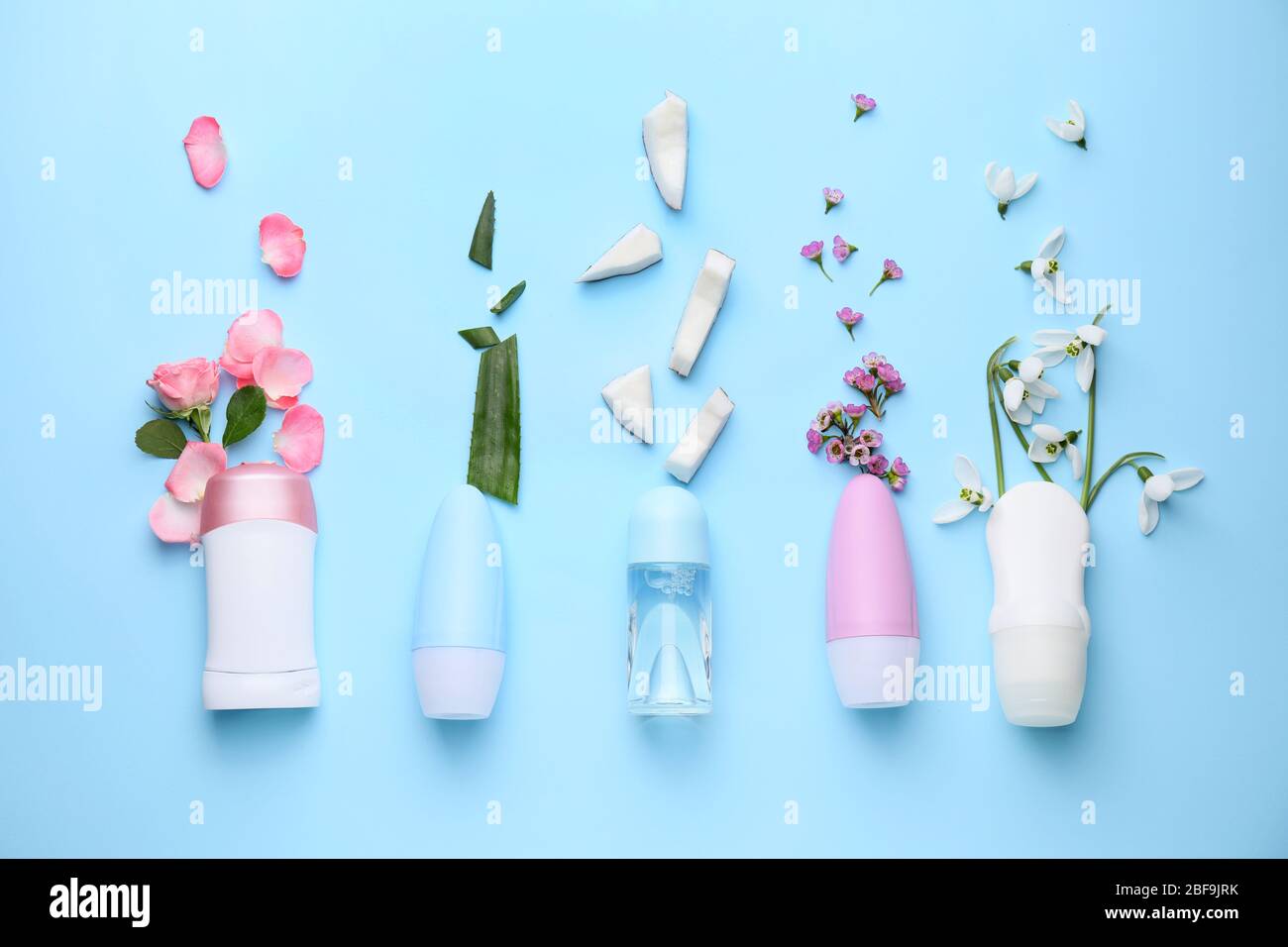 Different deodorants on color background Stock Photo - Alamy