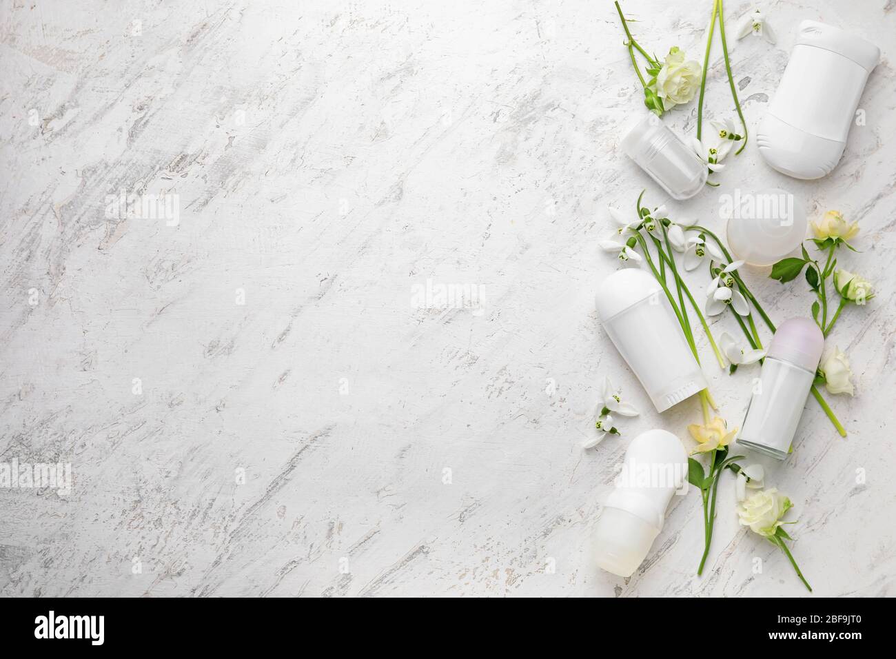 Different deodorants on light background Stock Photo - Alamy
