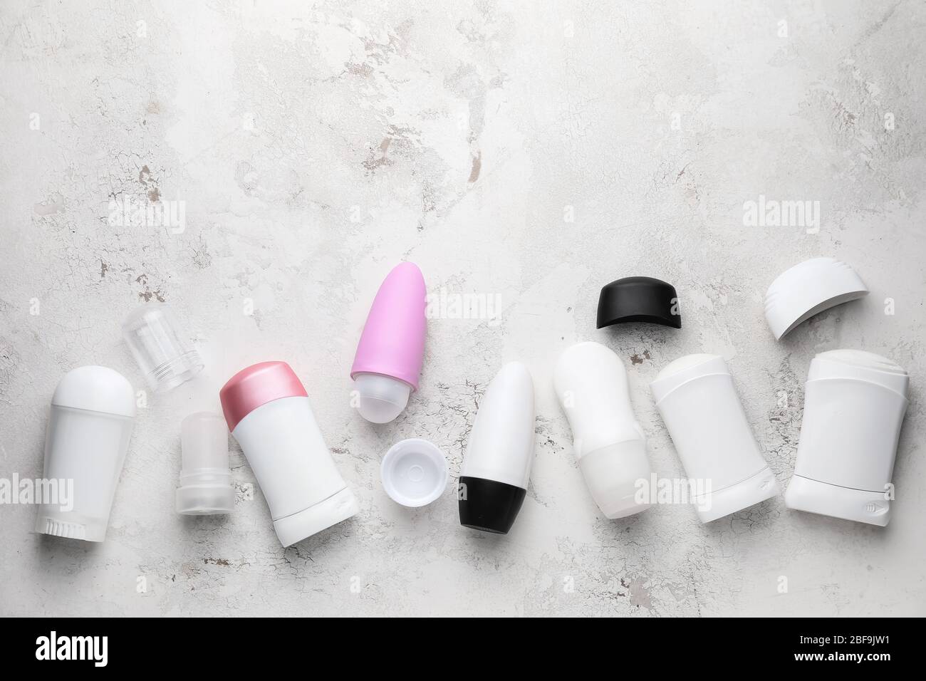 Different deodorants on light background Stock Photo - Alamy