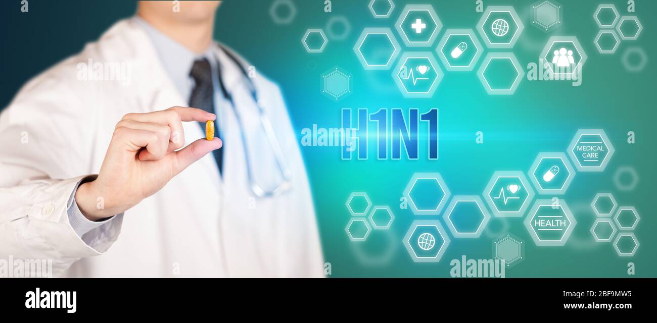 Close-up of a doctor giving you a pill with H1N1 inscription, medical ...