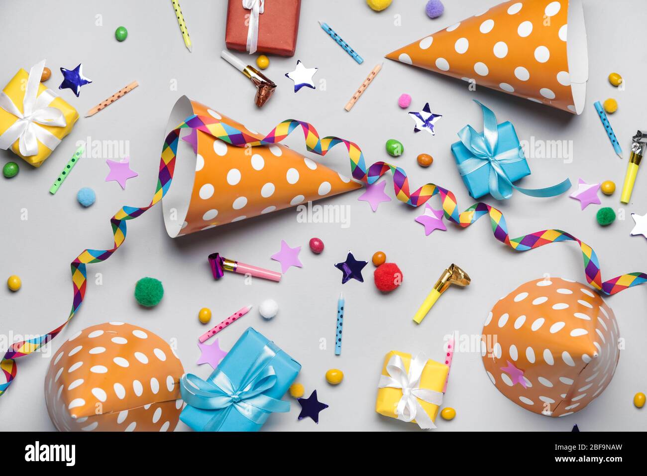 Birthday composition on grey background Stock Photo - Alamy