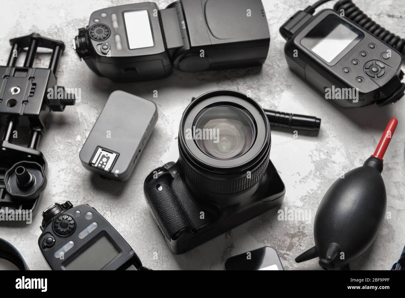 Modern photographer's equipment on grey background Stock Photo - Alamy