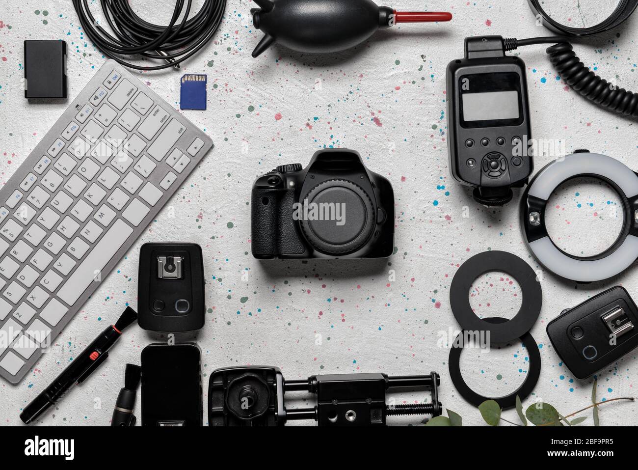 Modern photographer's equipment with computer keyboard on white ...